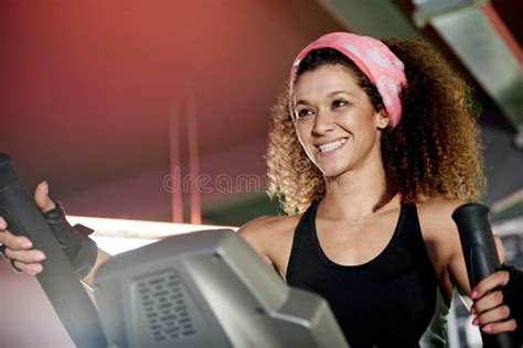 He Knows Whats Best For Her Workout A Personal Trainer Helping A Young Woman With Her Stepping