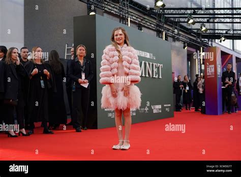 Olivia Lynes Poses For Photographers Upon Arrival At The Premiere Of