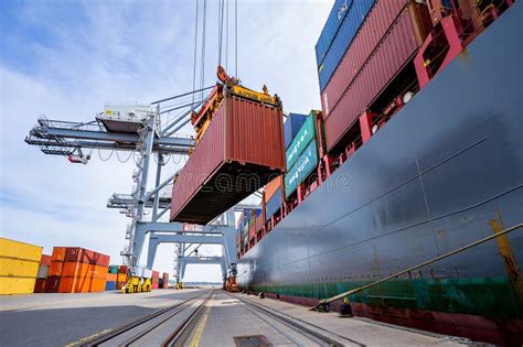 Loading Containers In Cargo Freight Ship With Industrial Crane Container Ship In Import And