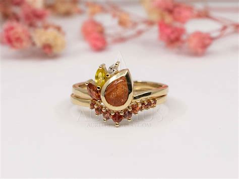 Fire Element Pear Orange Cabochon Sunstone And Orange Sapphire