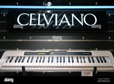 White synthesizers Casio, electronic piano Celviano in musical store ...