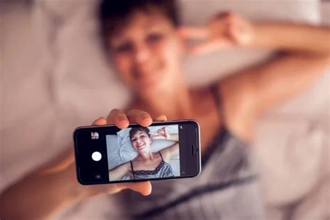 Young Woman With Short Hair Doing Selfie In The Bed People Technology