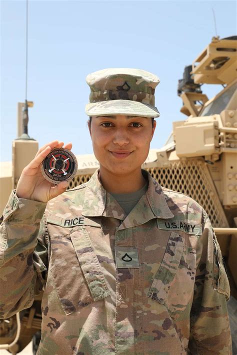 Private First Class Rice Poses With A Challenge Coin Nara And Dvids