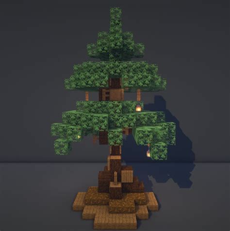 A Small Tree With Lots Of Green Leaves On It S Trunk And Branches In The Shape Of A House