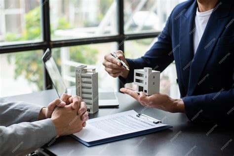 Premium Photo Sales Giving Male Customer Signing Sales Contract Asian Woman And Man Doing