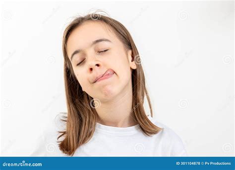 Funny Teenage Girl Licks Her Lips On A White Background Isolated Stock