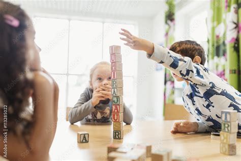 Babe Stacking Alphabet Blocks On Table Stock Photo Adobe Stock
