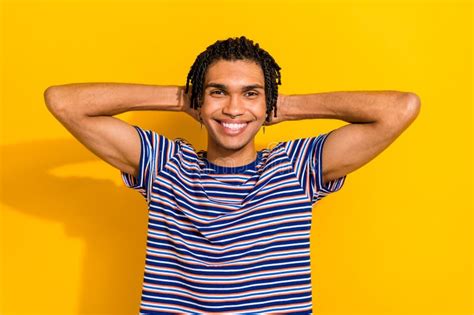 Photo Of Positive Satisfied Person Beaming Smile Arms Behind Head Enjoy Free Time Isolated On