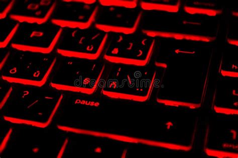 Modern Red Iluminated Backlit Keyboard Cyber Attack Hacking And Internet Security Concept