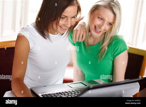 2 Girls Using Computer Online Stock Photo Alamy