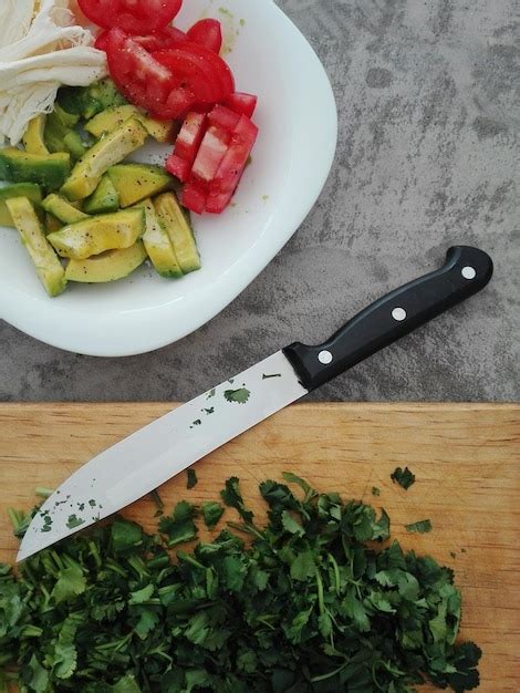Premium Photo Directly Above View Of Chopped Cilantro And Knife On