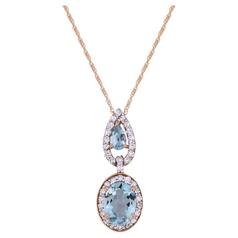 12 Ct Oval Aquamarine And Diamond Accent 14k Yellow Gold Pendant
