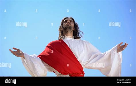 Jesus Christ In White Robe Turning To God With Opened Palms Historical