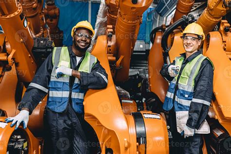 Happy Portrait Engineer Worker Robot Arm Welding Assembly Line