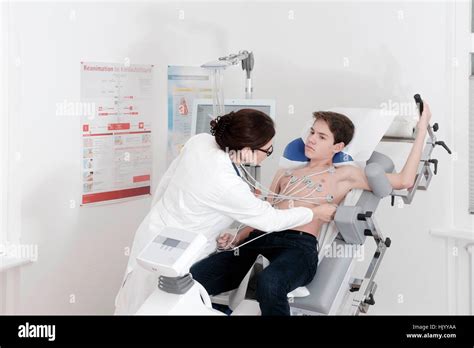 Cardiologist Performs Exercise Strees Test On Cycle Ergometer On