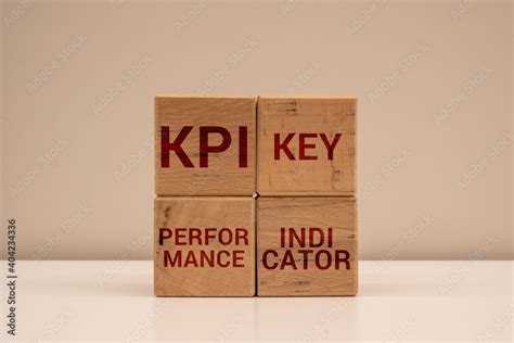 Word KPI Made With Wood Building Blocks KPI Data Report KPI Metrics Analysis Concept With
