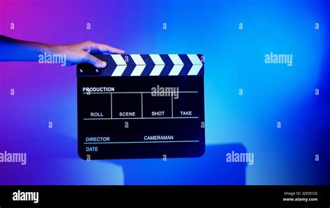 Movie Clapper Board Crew Hand Holding Plastic And Wooden Film Slate Board Against Camera Movie