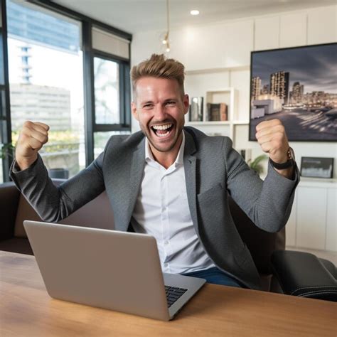 Premium Photo Smiling Man In Suit Sitting At A Desk With Laptop Computer