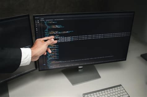 Premium Photo Group Of Programmers Brainstorm Together To Write Programs On The Computer