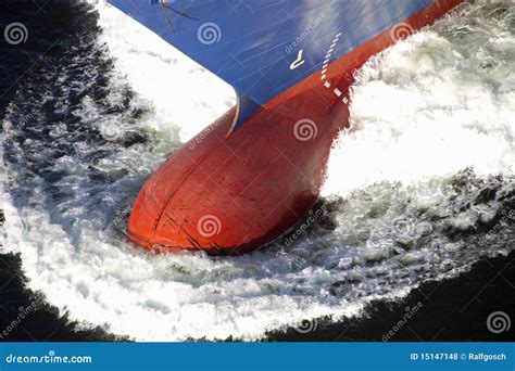 Container Vessel Berthing At An Industrial Port Tugboat Push Large Cargo Vessel To Berth At