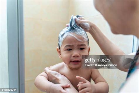 Mother Washing Son Hair Photos And Premium High Res Pictures Getty Images