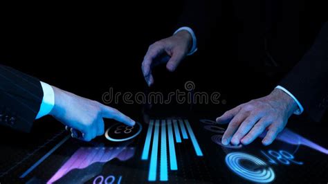 Two Business Professionals Analyzing Digital Financial Data On Interactive Touch Screen With