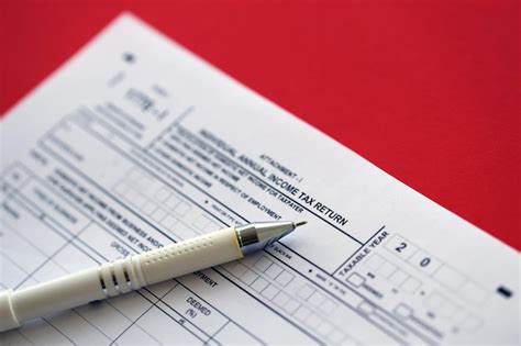 Premium Photo Indonesian Tax Form Individual Income Tax Return And Pen On Table