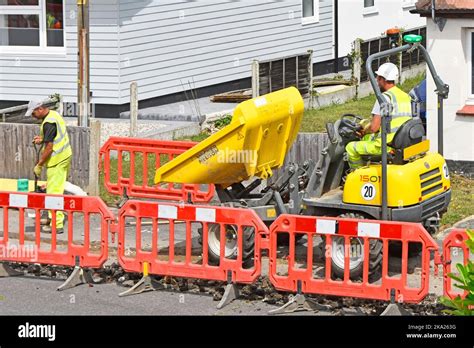 Labourer Man Working With Dumper Truck Driver Infrastructure Project Installing Underground
