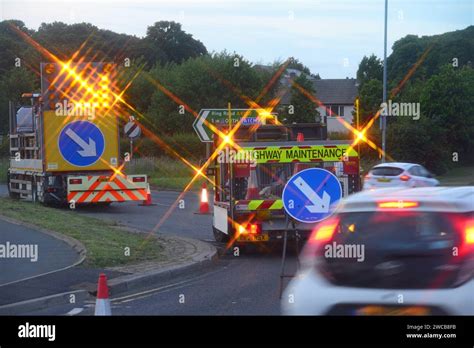 Traffic Passing Flashing Warning Lights On Highway Maintenance Lorry
