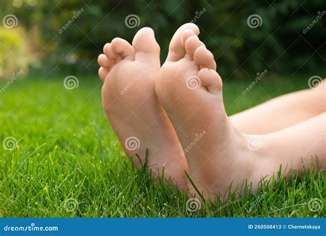 Teenage Girl Sitting Barefoot On Green Grass Outdoors Closeup Stock Image Image Of Garden