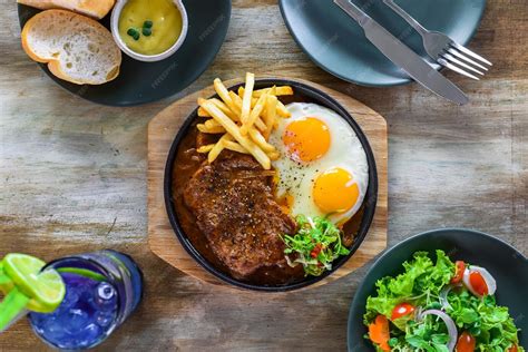 Premium Photo Vietnamese Beef Steak With French Fries Fried Eggs