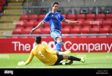 Qatar Goalkeeper Amine Lecomte Addani Slides At The Feet Of Northern Irelands William Grigg