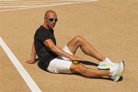 Athletes Man Is Massaging His Leg By Massage Ball Techniques For Tense After Active Workout