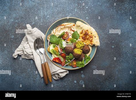 Middle Eastern Arab Meal With Fried Falafel Hummus Vegetables Salad
