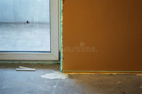 Two Green Laser Lines Smoothly Overlap The Floor Surface Ensuring Flawless Alignment In The
