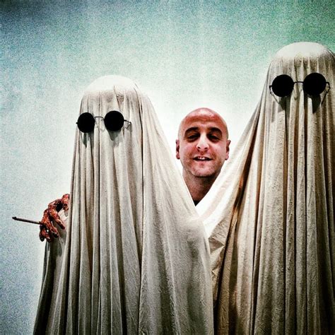 Premium Photo Portrait Of Young Man With Ghosts Against Colored Background