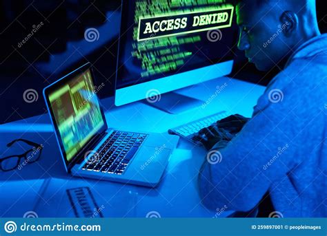 Hes Going To Crack It Soon A Young Male Hacker Cracking A Computer