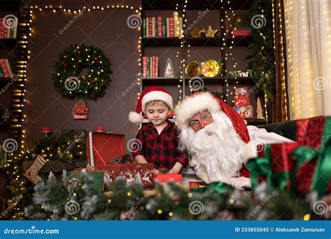 Little Boy Visiting Santa Claus Makes A Wish Merry Christmas Holidays