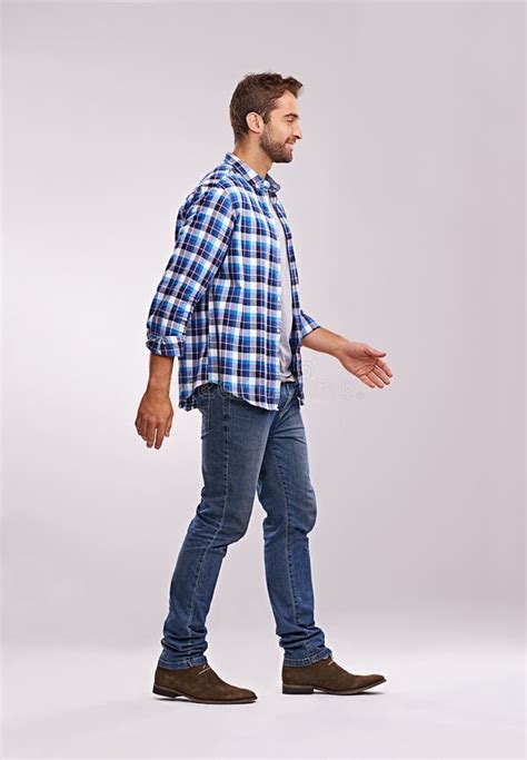 Man Fashion And Smile In Studio Walking And Casual Flannel Shirt For