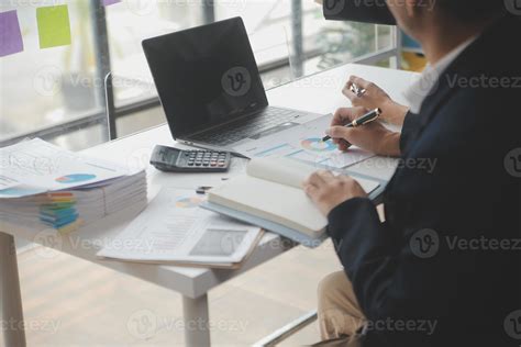 Business Professionals Group Of Young Confident Business People Analyzing Data Using Computer