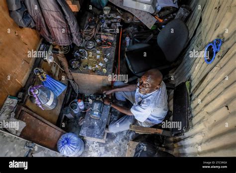 Samwel Mwangi Take A Posture While Making Jewelries At His Shop In Kibera Slum On October 25