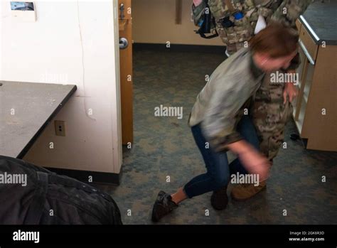 A Member Of The 88th Security Forces Squadron Helps Remove A Reluctant