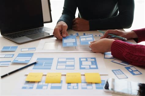 Premium Photo Group Of Ux Developer And Ui Designer Brainstorming About App Interface Design