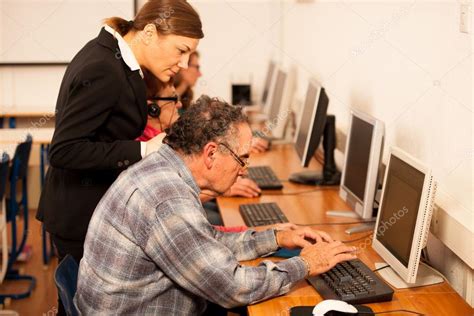 Group Of Adults Learning Computer Skills Intergenerational Tran Stock