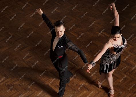Free Photo Man And Woman Dancing Together In A Ballroom Scene