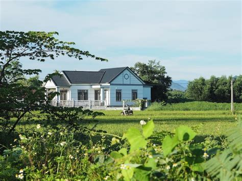 Premium Photo Built Structure On Field Against Sky