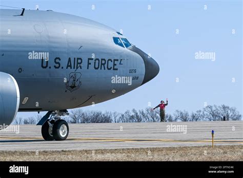 An Airman With The 155th Air Refueling Wing Signals To Park For A Kc