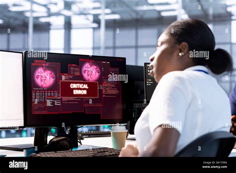 Engineer In Server Hub Investigating Breach Alerts Working To Protect