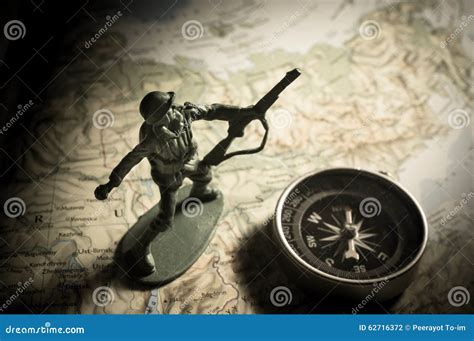 Soldier Toys With Compass On Map Royalty Free Stock Image