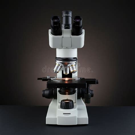 Laboratory Microscope With A White Body And Black Stage Featuring Dual